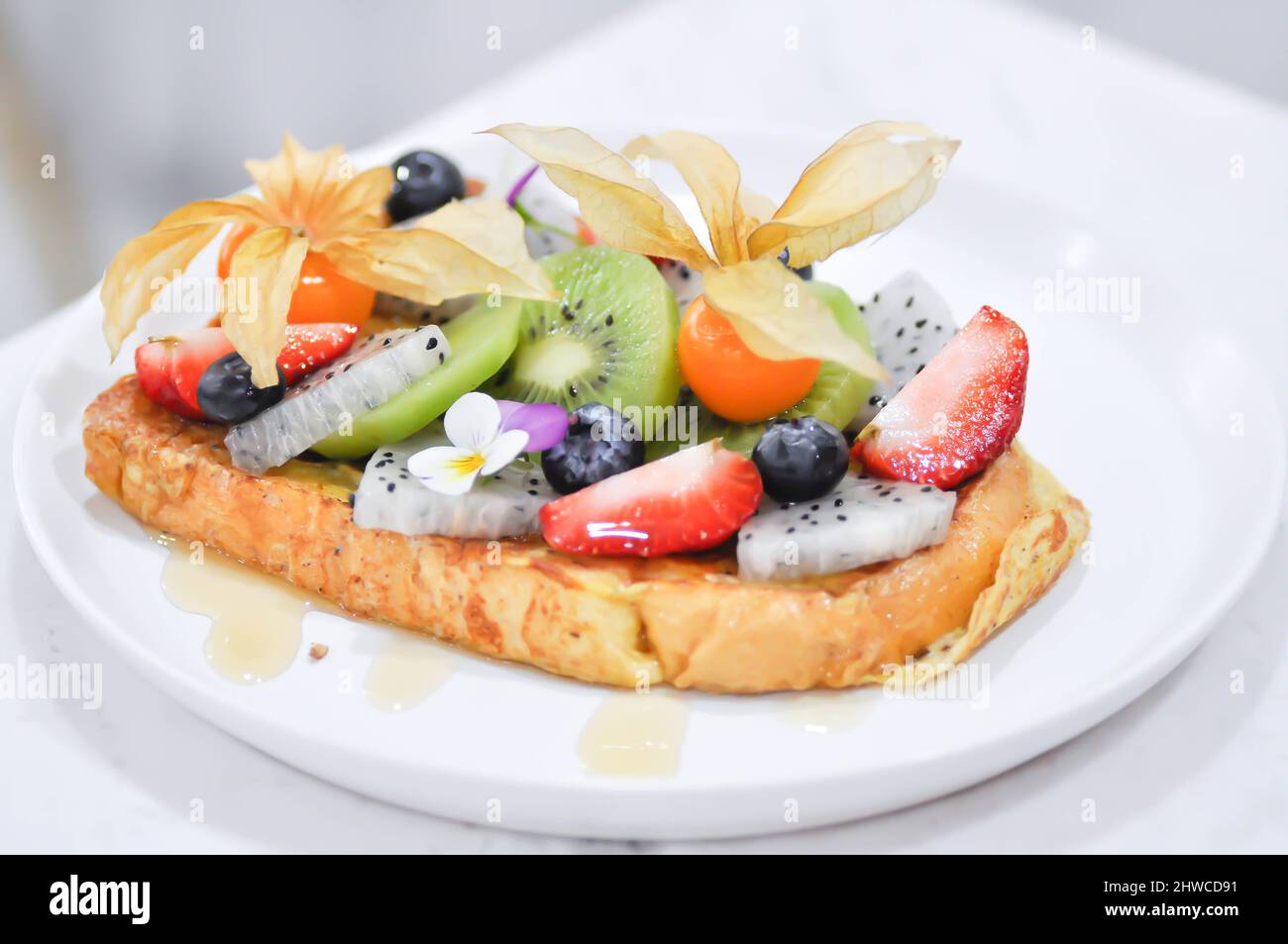 toast or French toast with fruit topping Stock Photo - Alamy