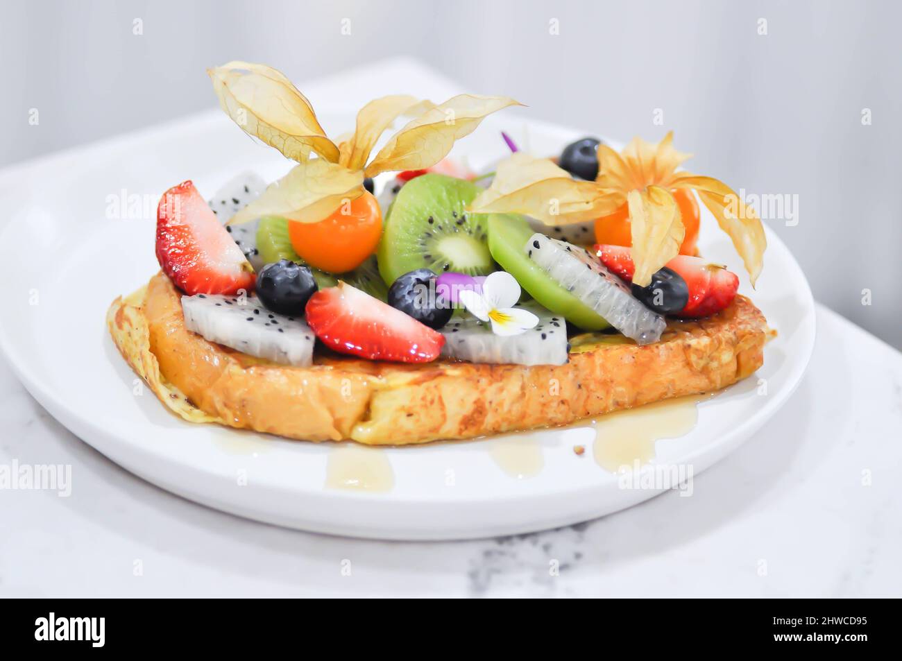 toast or French toast with fruit topping Stock Photo - Alamy
