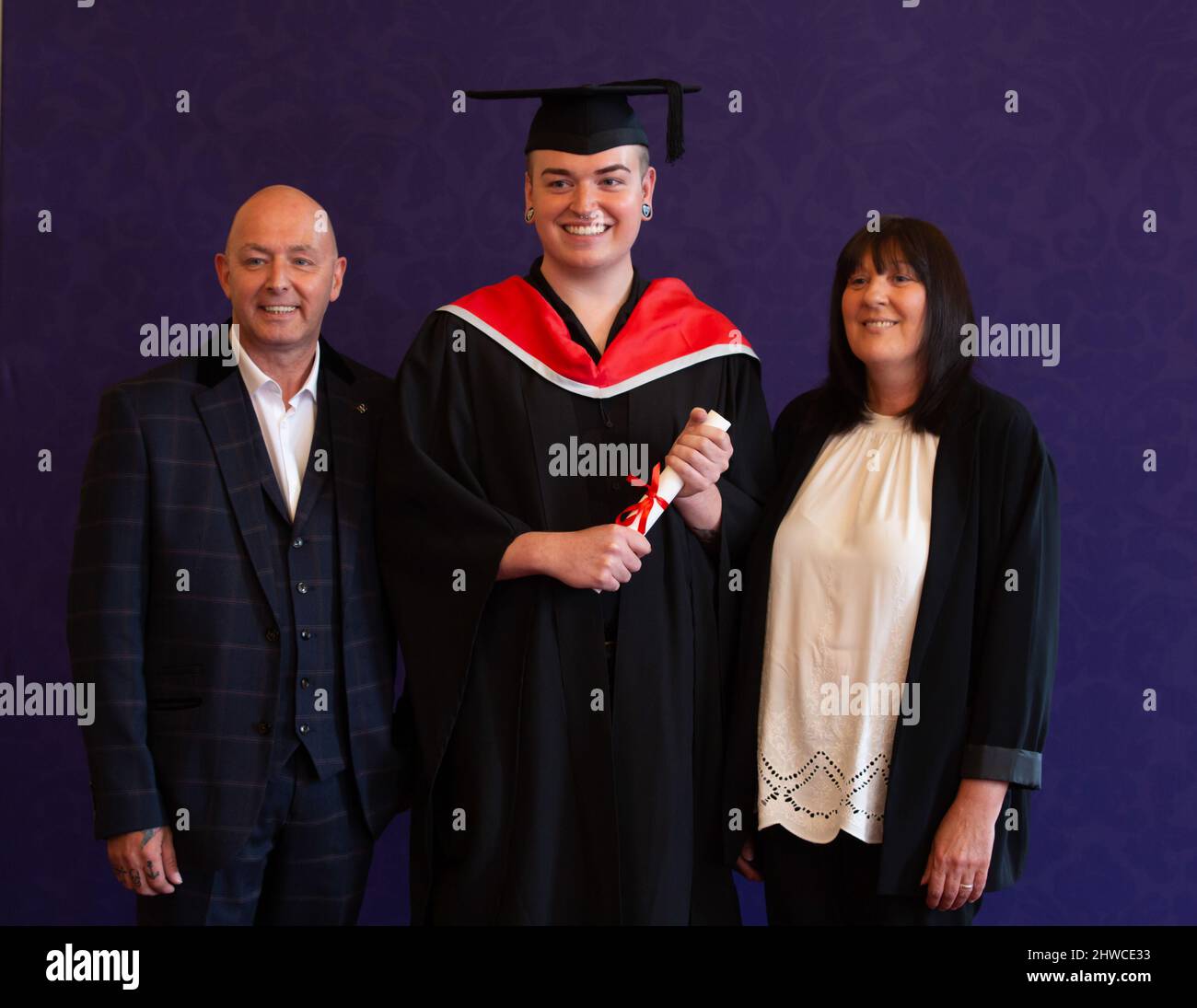 A European Graduate and family poses for the official photographer at ...
