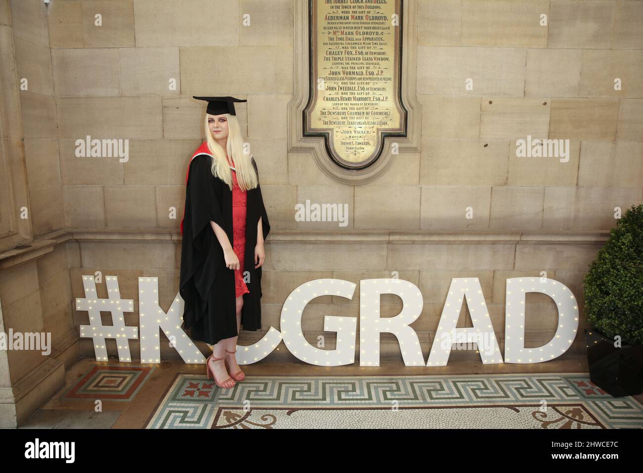 A pretty european female graduate poses for a twiter photograph at her ...