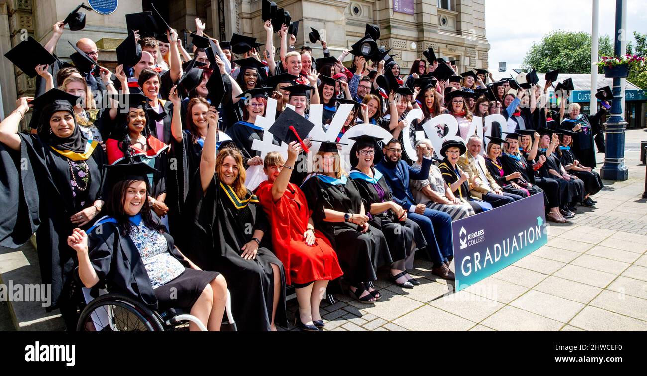 Graduates celebrate at their graduation day ceremony. This formal event ...