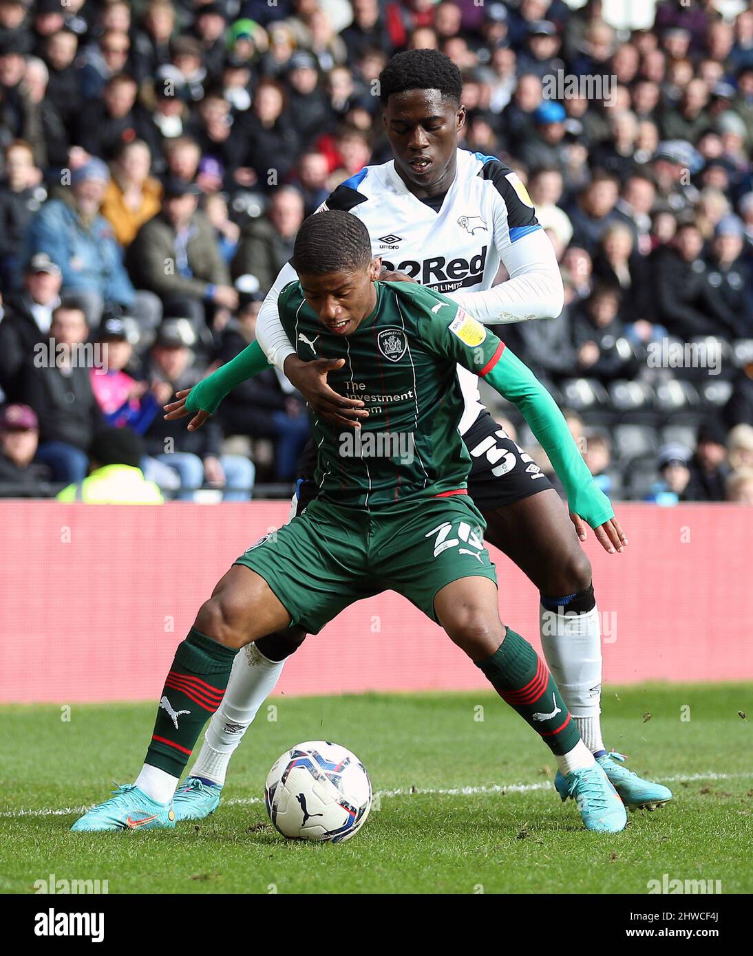 Barnsley's Remy Vita (left) and Derby County's Malcolm Ebiowei during ...