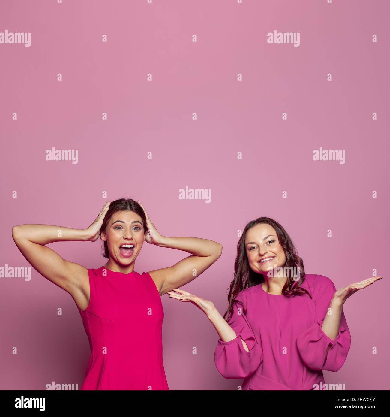 Two happy surprised woman laughing, screaming and celebrating success ...