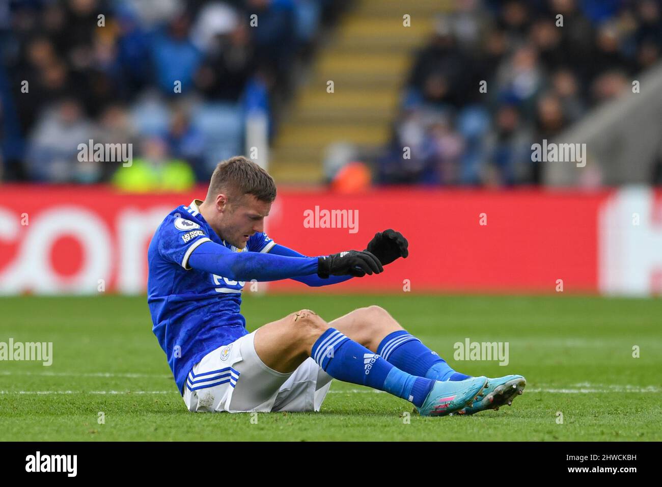 Jamie Vardy #9 of Leicester City sits on the pitch after appearing to pick up an injury Stock ...