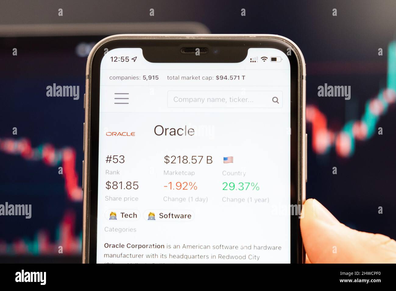 Oracle stock price on the screen of mobile phone in mans hand with ...