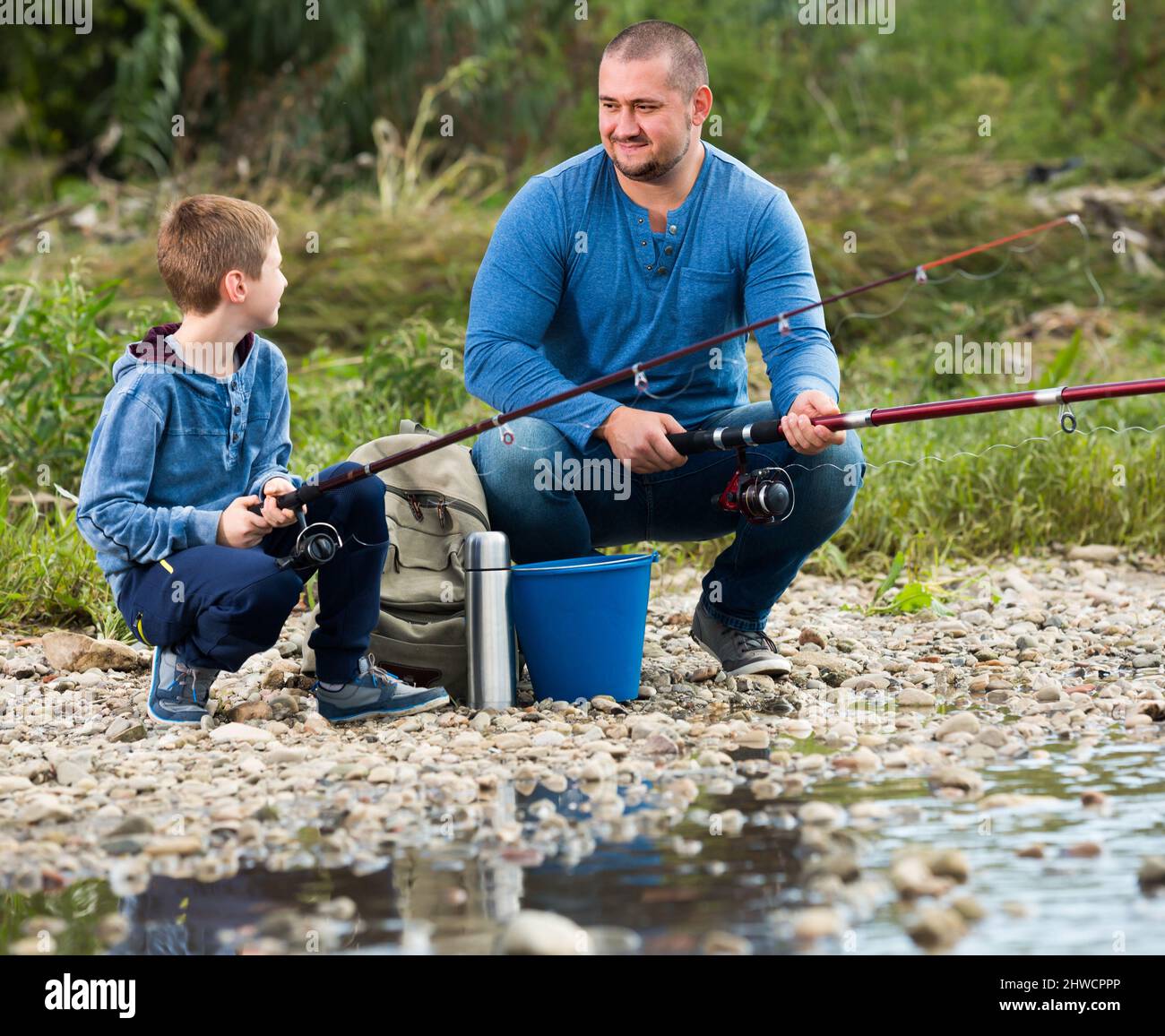 Father boy fishing rods hi-res stock photography and images - Alamy