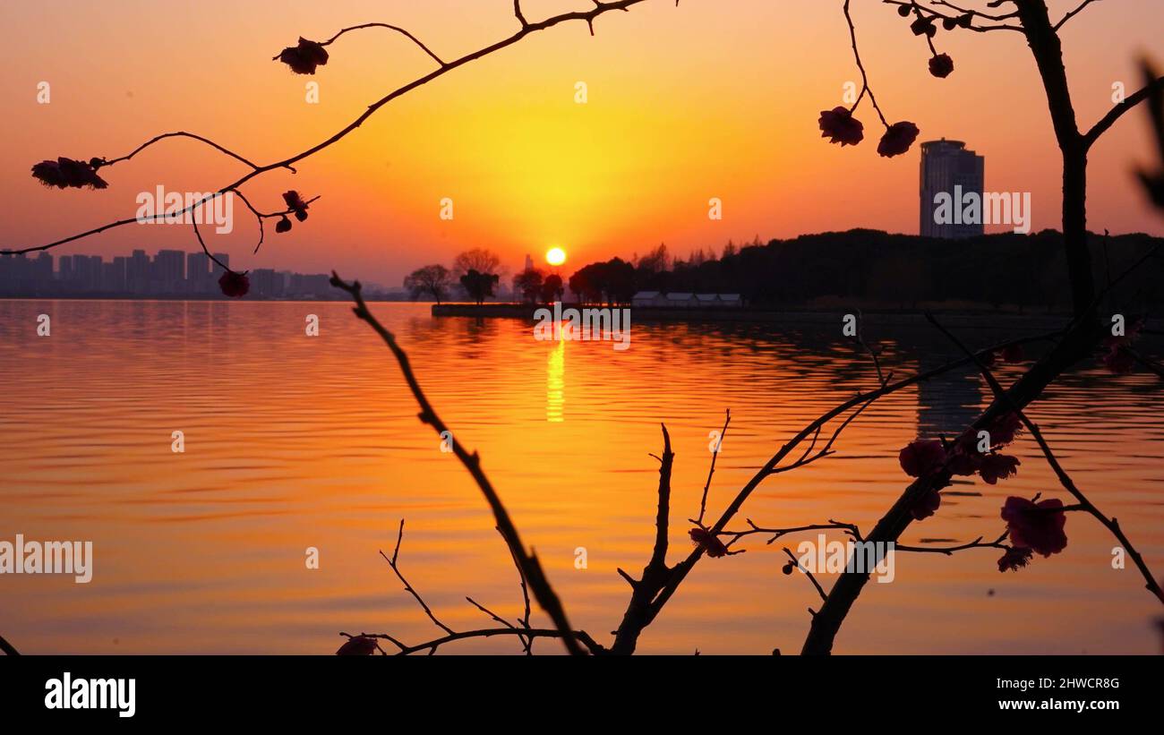Suzhou, China. 24th Feb, 2022. A view of the Suzhou Dushu lake during sunset. (Credit Image ...