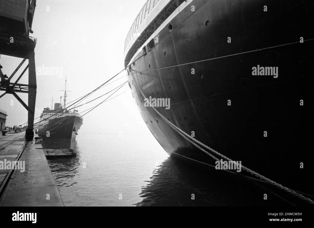 The bow of the famous ocean liner QE2 tied up at the paasenger terminal ...