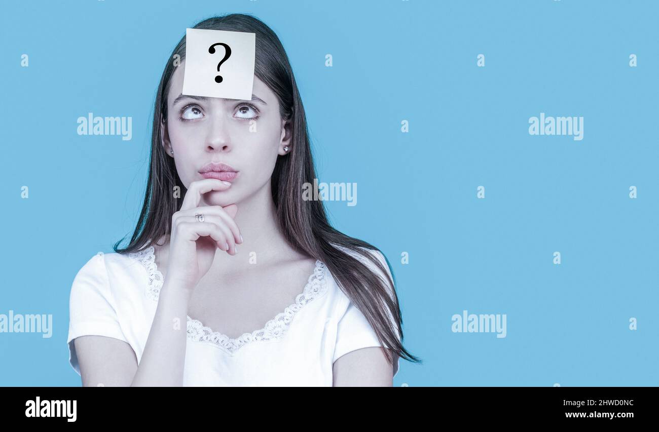 Thinking woman with question mark looking up. Doubtful girl asking ...