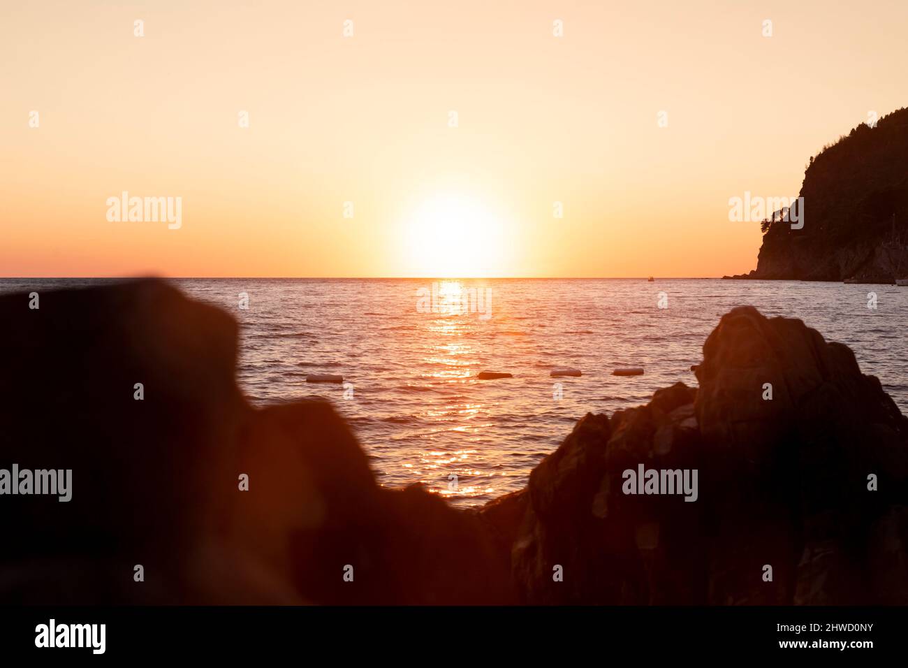Beautiful sunset at the horizon at sea Stock Photo - Alamy