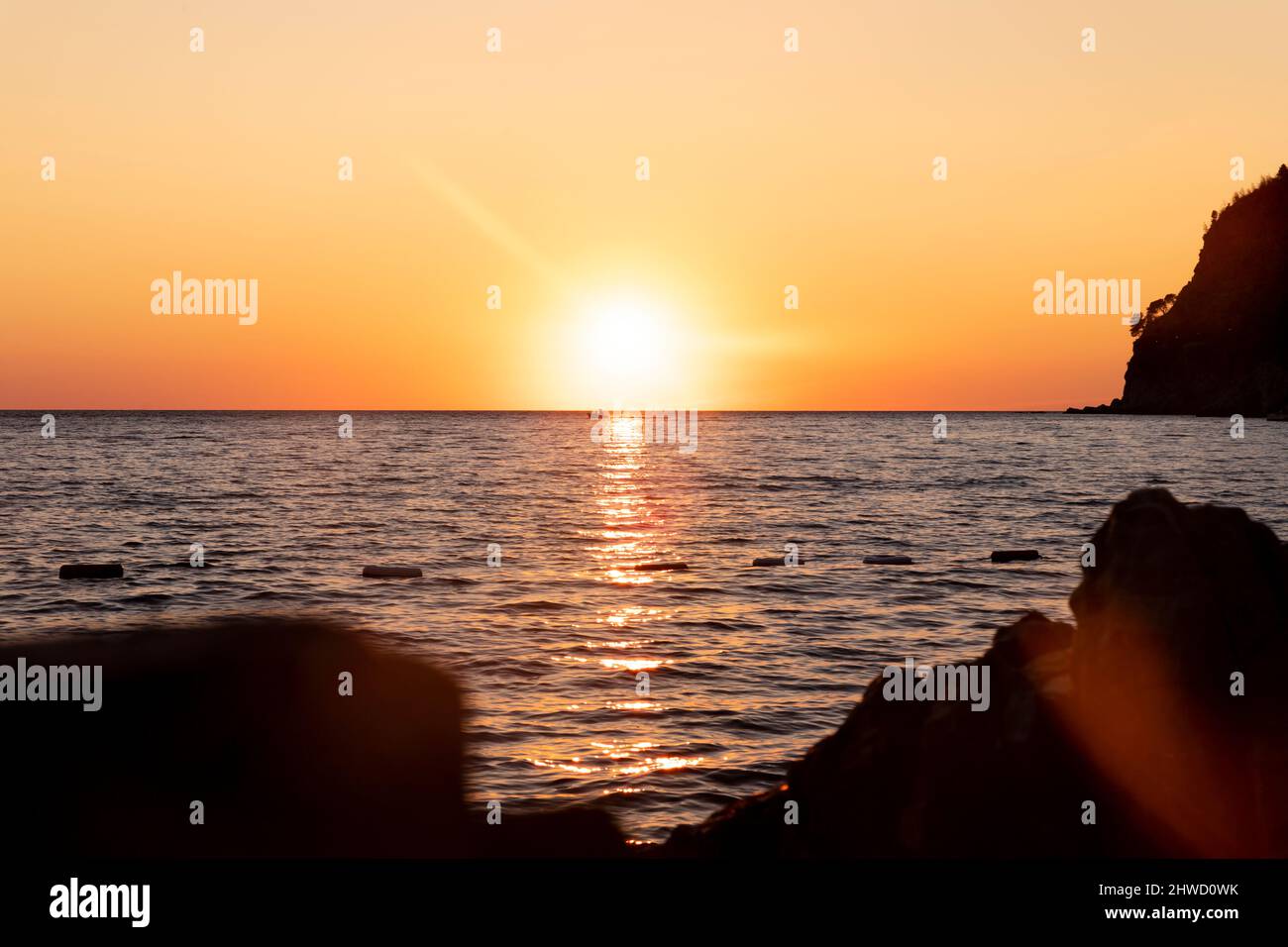 Beautiful sunset at the horizon at sea Stock Photo - Alamy