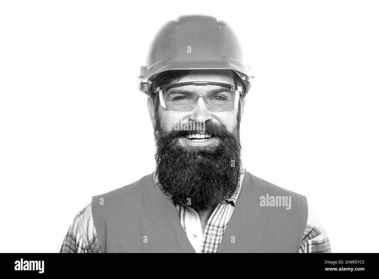 Portrait of a builder smiling. Builder in hard hat, foreman or ...