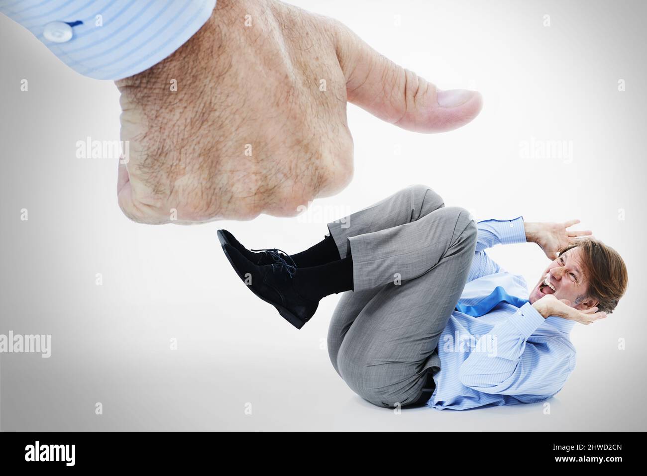 Fear of success. Studio shot of a scared businessman protecting himself ...