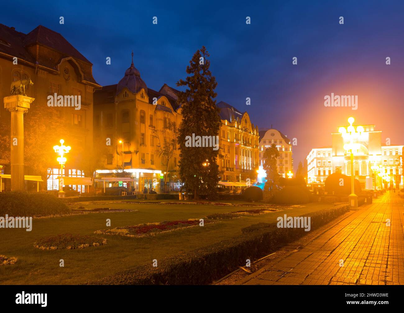 Illuminated Victoriei Square with National Opera house at dusk ...