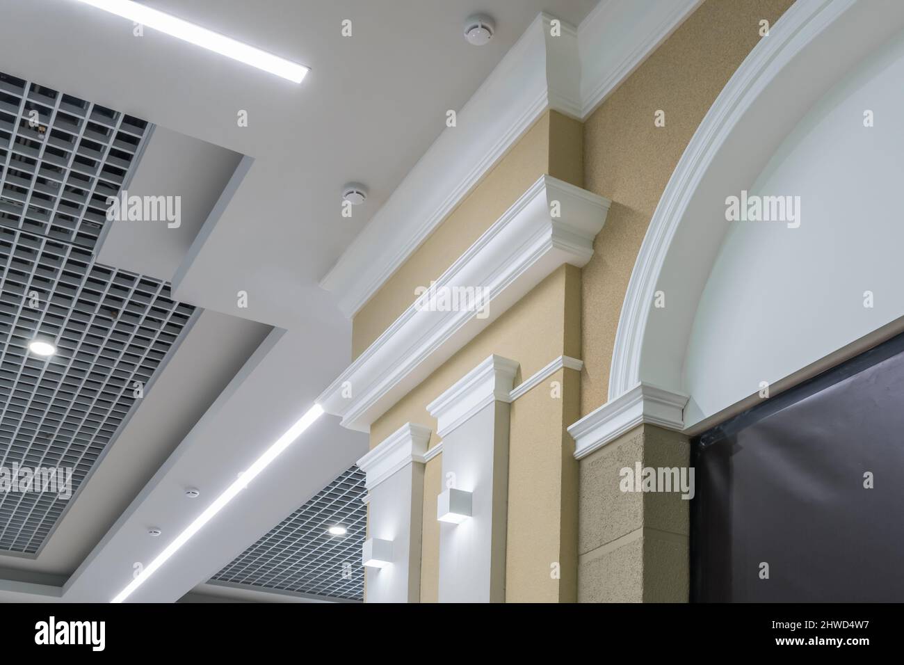 Detail of corner ceiling with intricate crown molding on column with ...