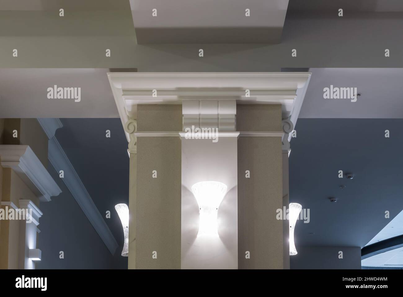 Detail of corner ceiling with intricate crown molding on column with ...