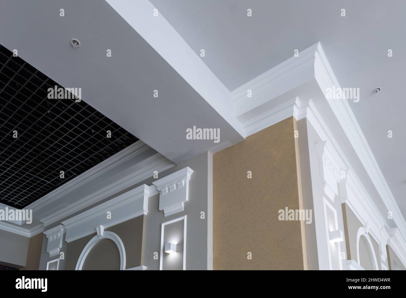 Detail of corner ceiling with intricate crown molding on column with ...