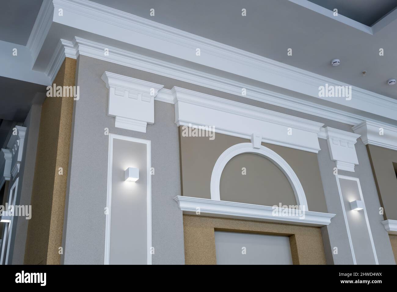 Detail of corner ceiling with intricate crown molding on column with ...