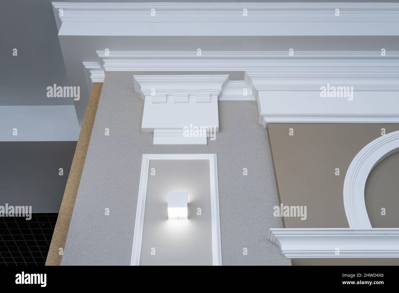 Detail of corner ceiling with intricate crown molding on column with ...