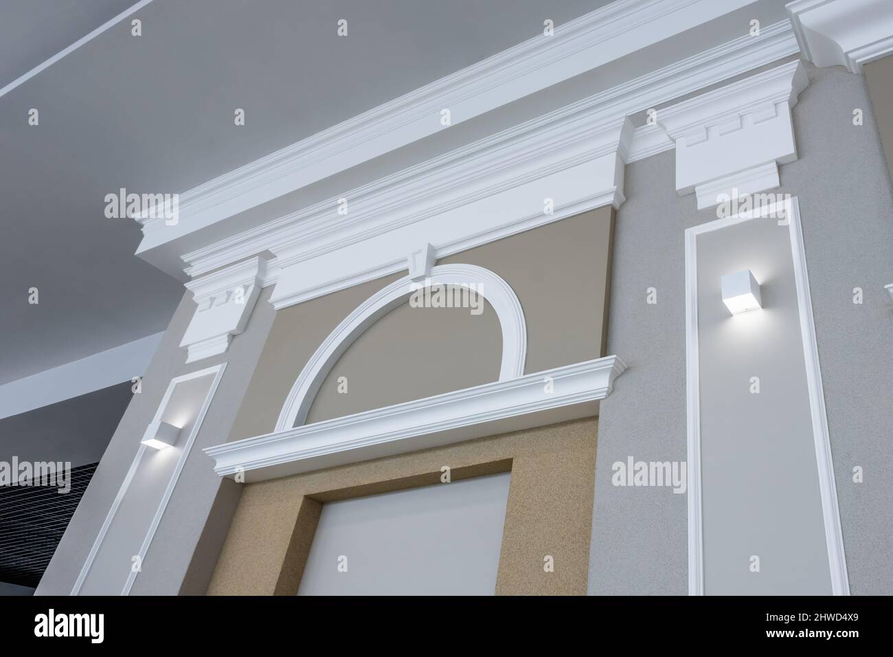 Detail of corner ceiling with intricate crown molding on column with ...