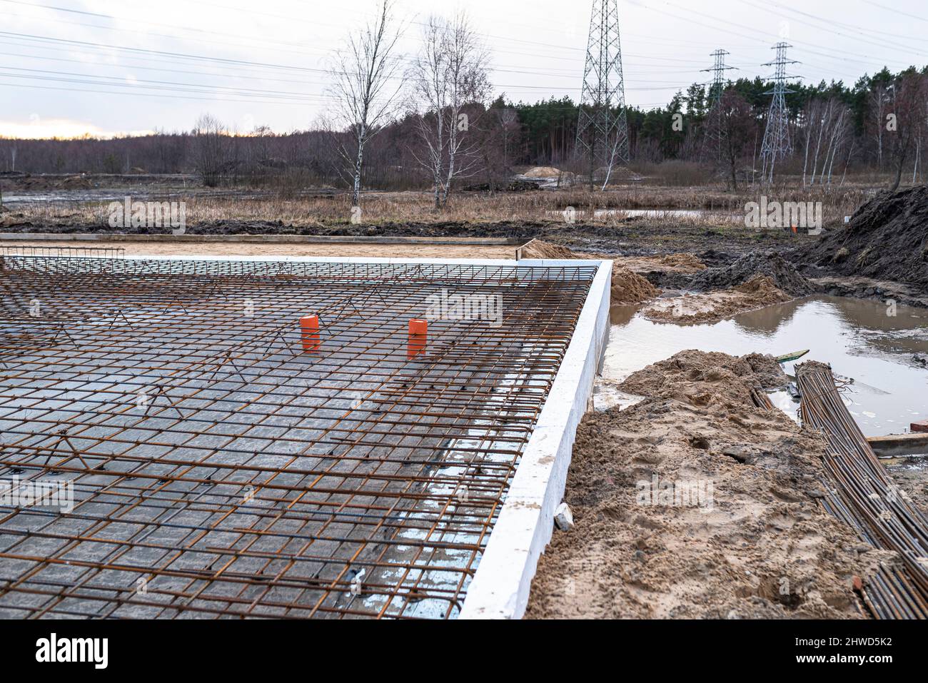 The foundation slab is made of reinforcement rods, bound with tie wire ...