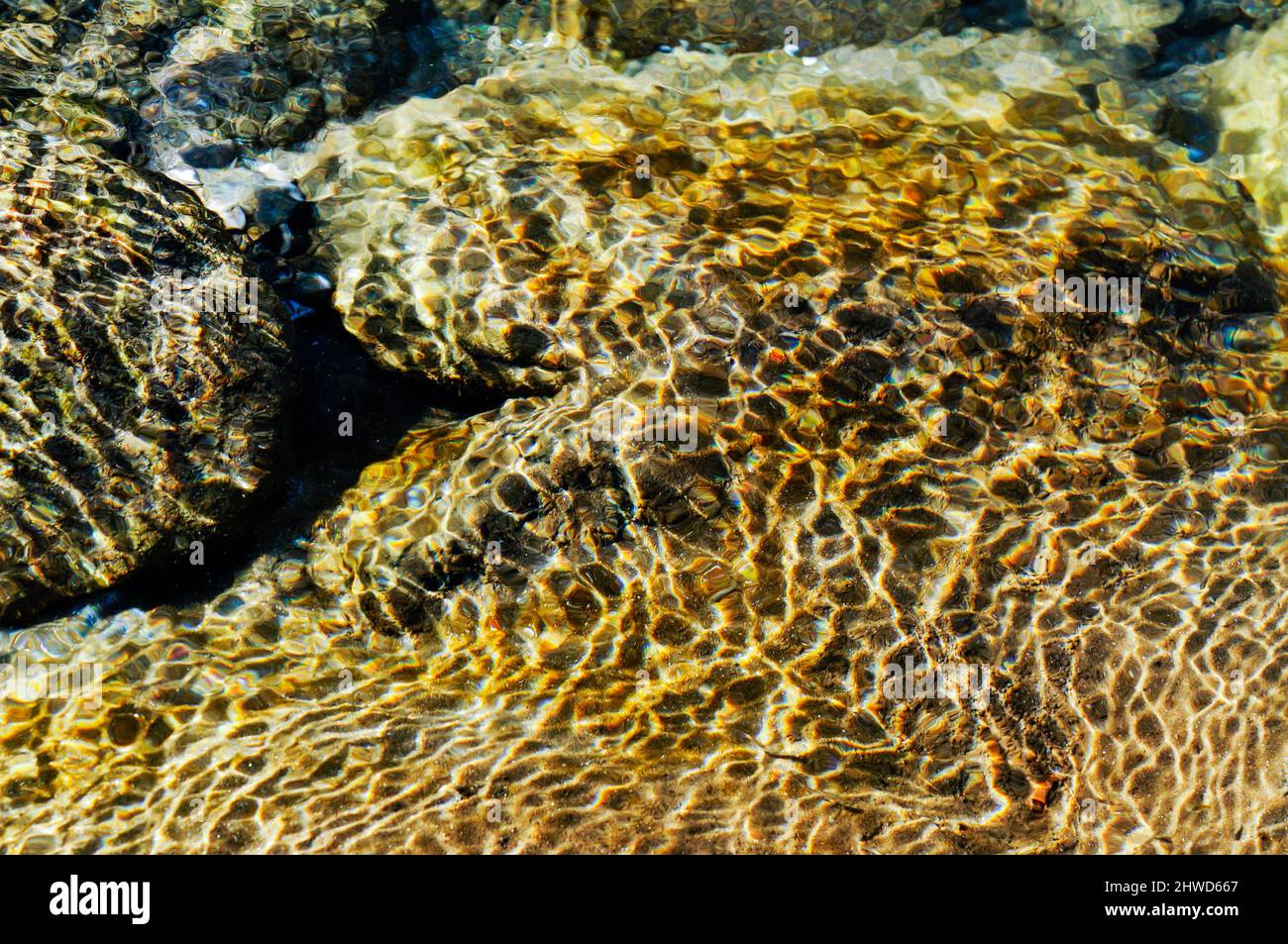 Abstract nature underwater reflection of sand and rocks , Reshi River ...