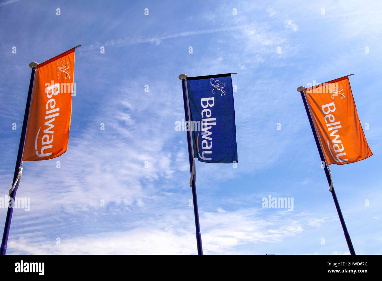 Orange and blue flags outside a Bellway Homes development, new house ...
