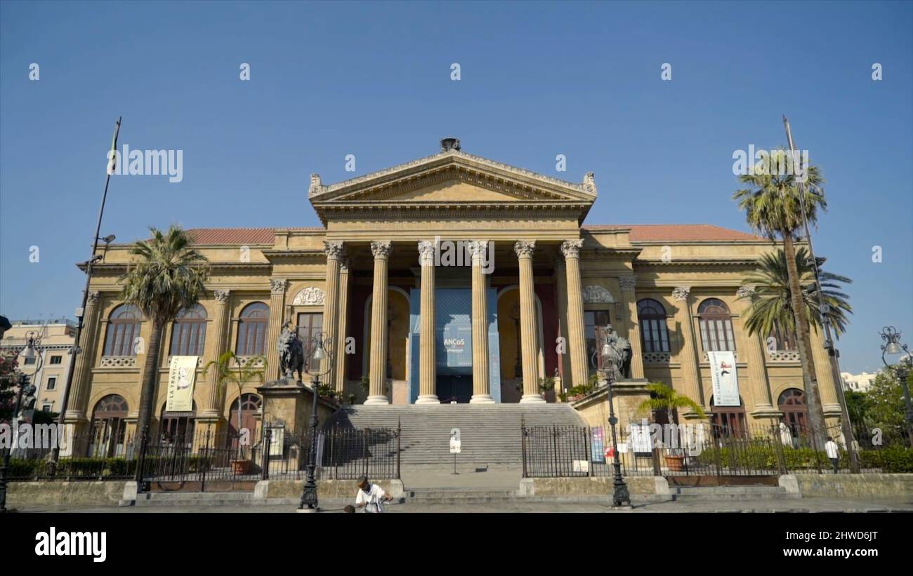 Facade of ancient building with columns and triangular portico. Action ...