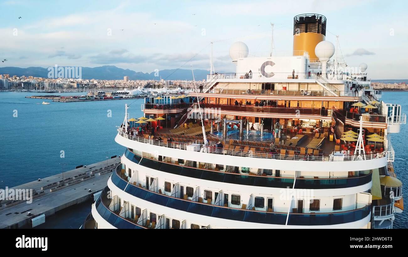 Large Cruise ship sailing across sea near the harbor. Stock. Top view ...
