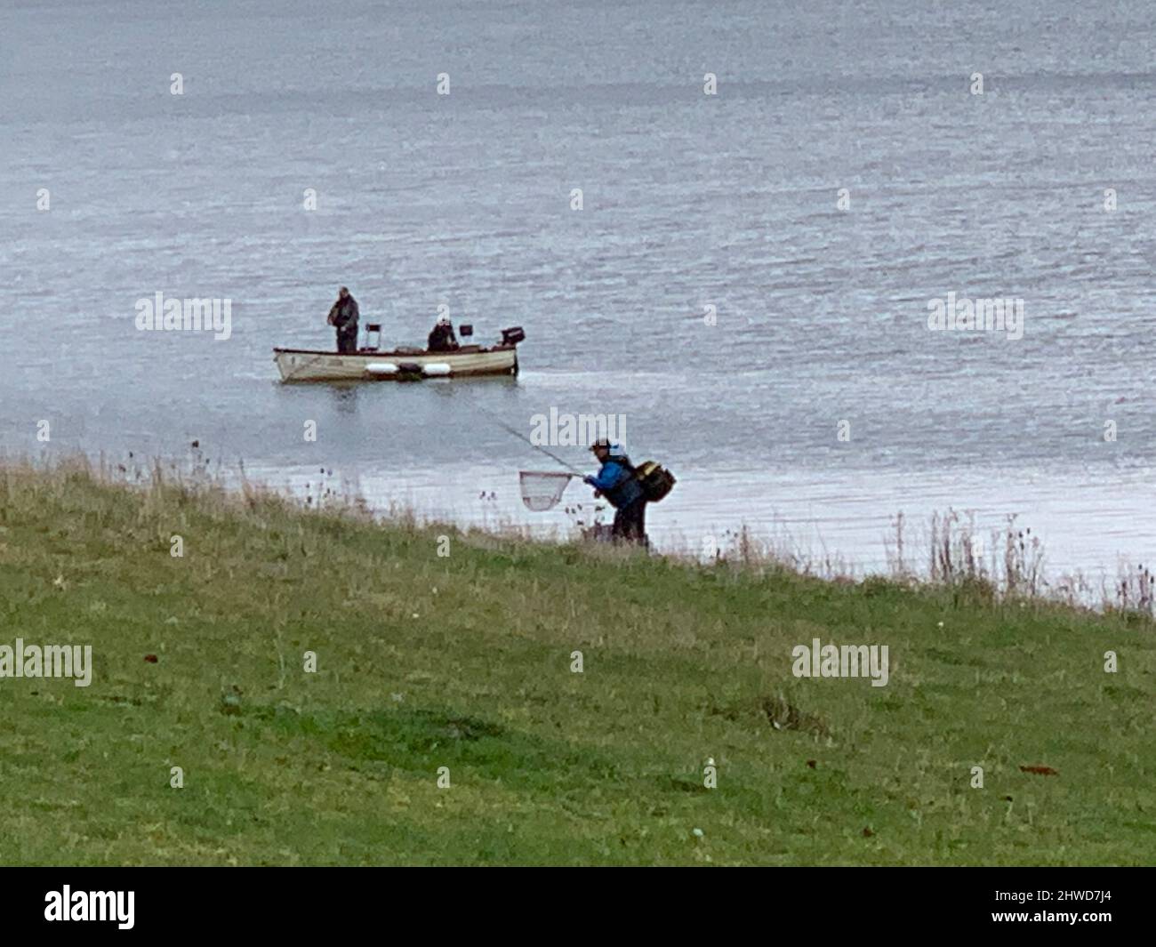 fisherman fishing in Draycott Water Southern water Warwickshire people ...