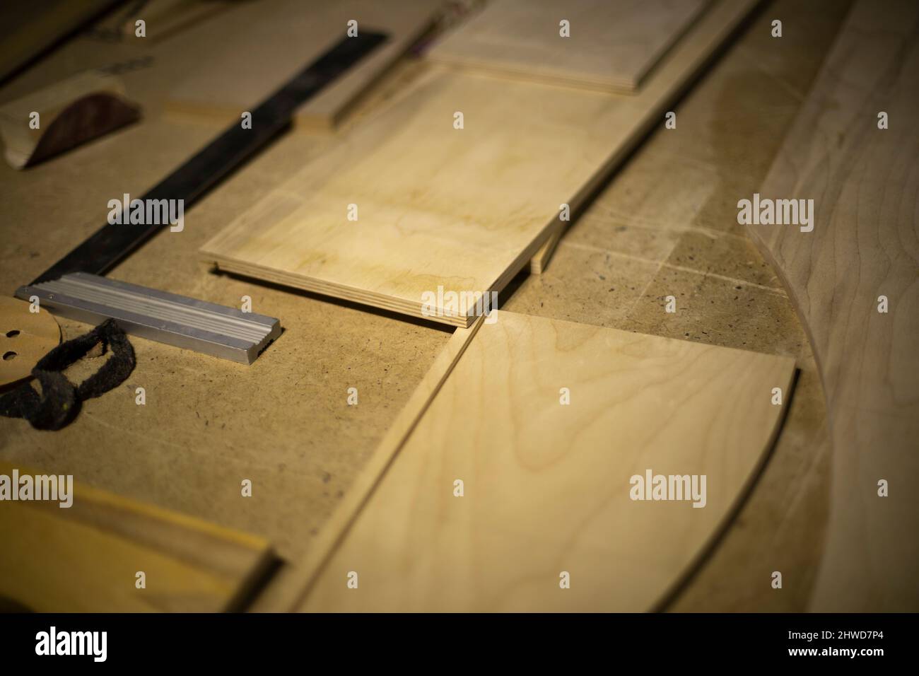 Details of carpentry workshop. Wooden objects on table. Table in ...