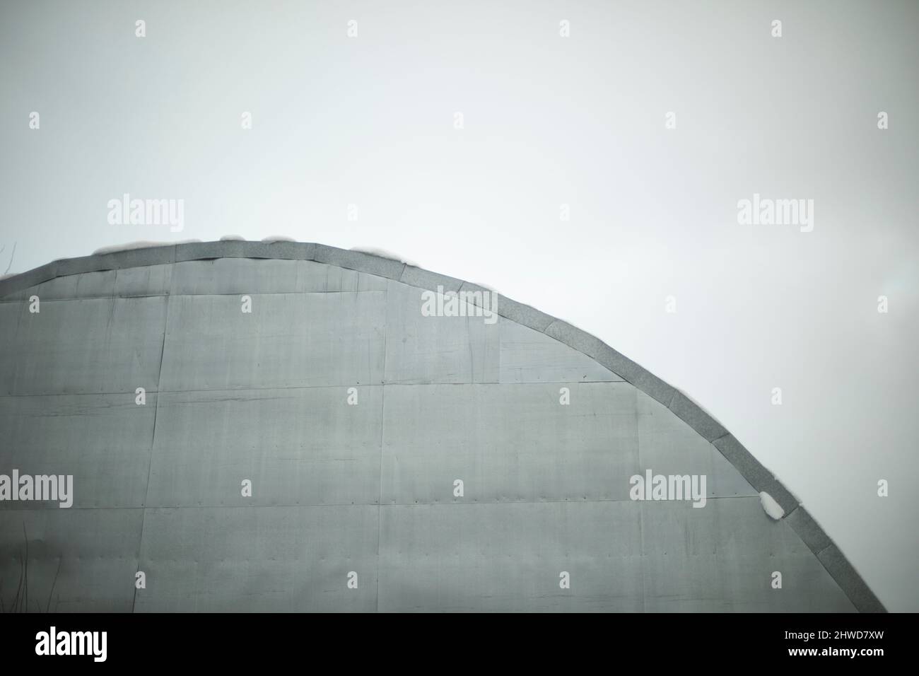 Roof of warehouse. Building with round roof. Stainless steel wall ...