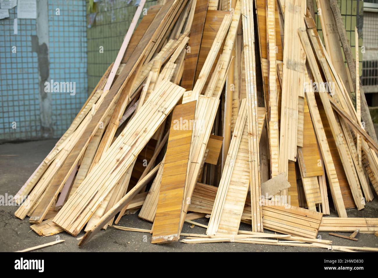 Broken parquet. Waste after repair. Boards from floor. Construction ...