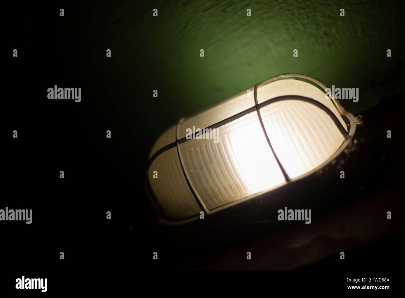 Lamp in entrance. Duty light. Bad equipment. Twilight. Darkness due to ...