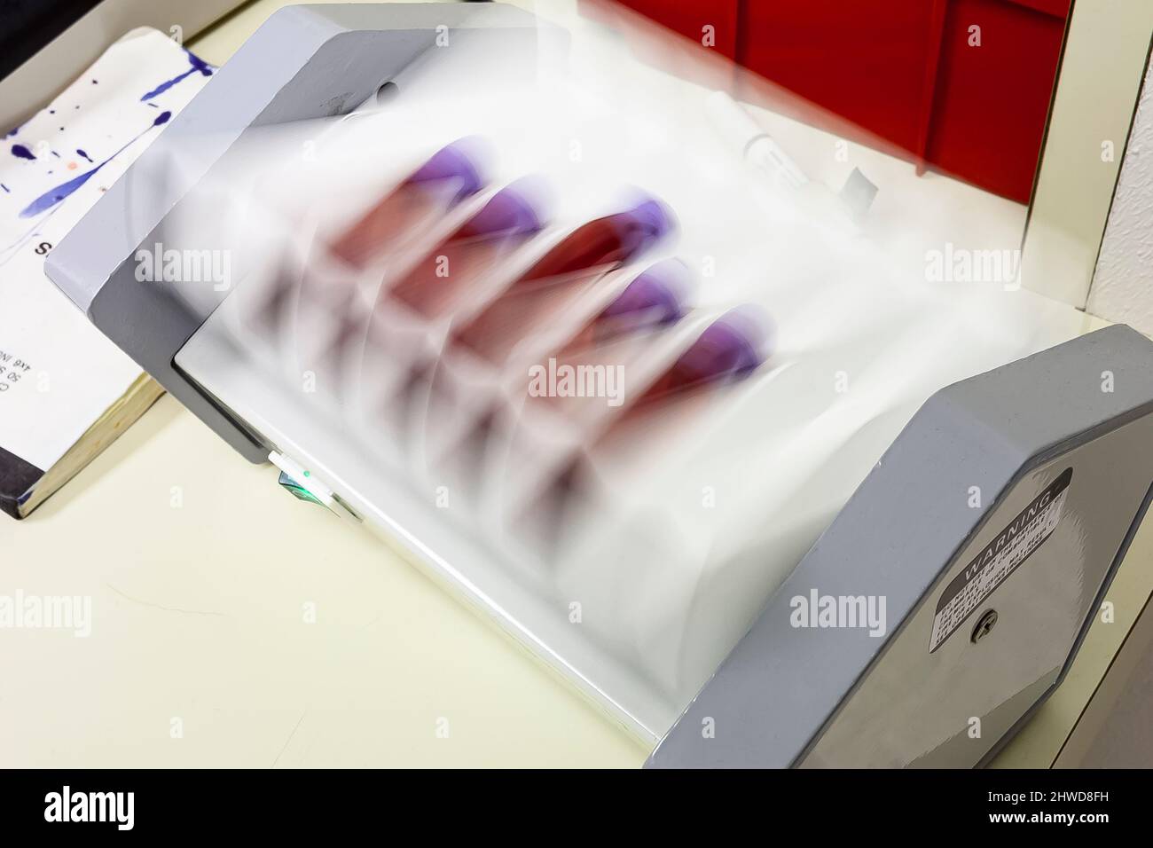 A motion blurred shot of a blood tube rocker in action Stock Photo - Alamy