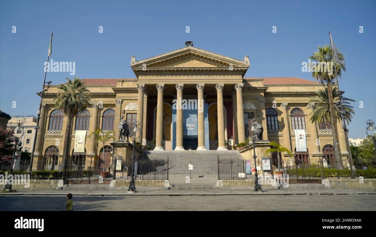 Facade of ancient building with columns and triangular portico. Action ...