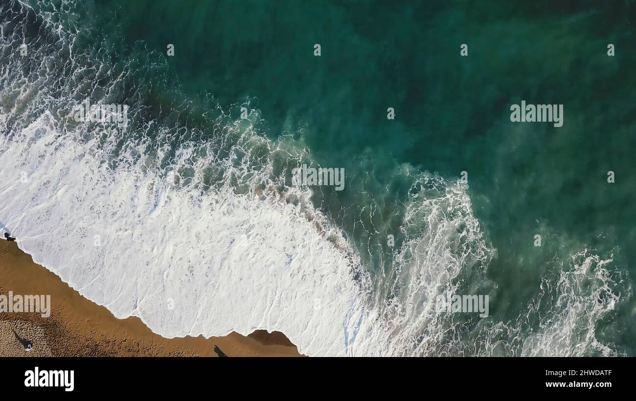 Sand beach. Stock. Top view of a beautiful sandy beach with the blue ...