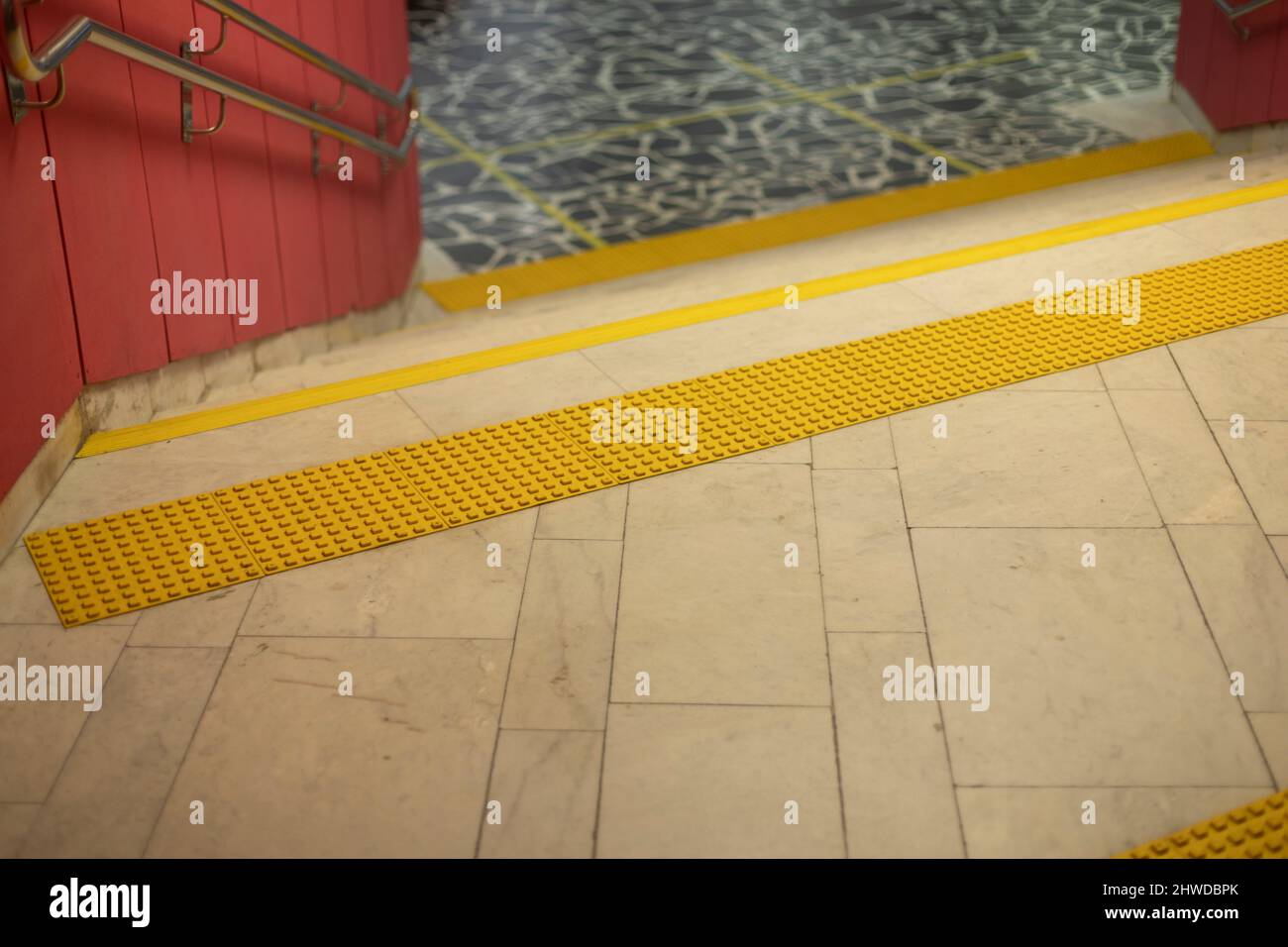 Surface for visually impaired. Yellow limiter for blind. Markings on ...