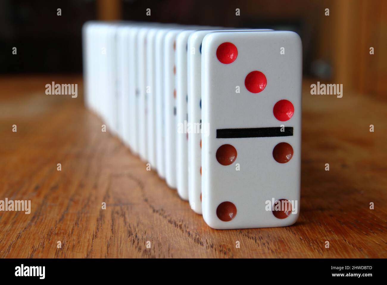 Line of dominoes Stock Photo - Alamy