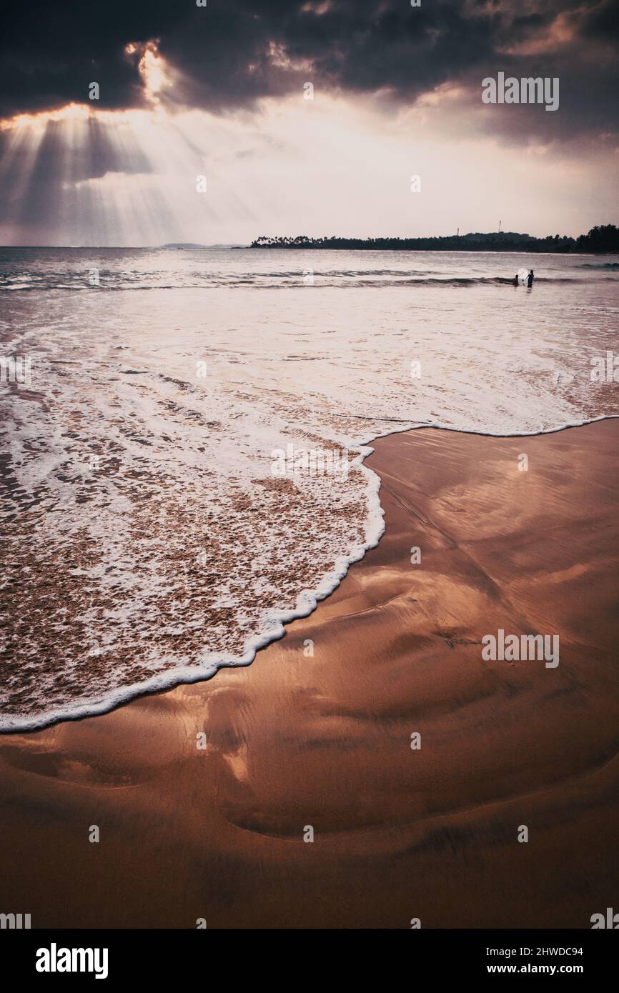 beautiful sunset over tropical beach Stock Photo - Alamy