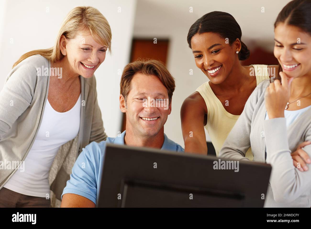 Taking pride in their work together. Shot of a work team gathered ...