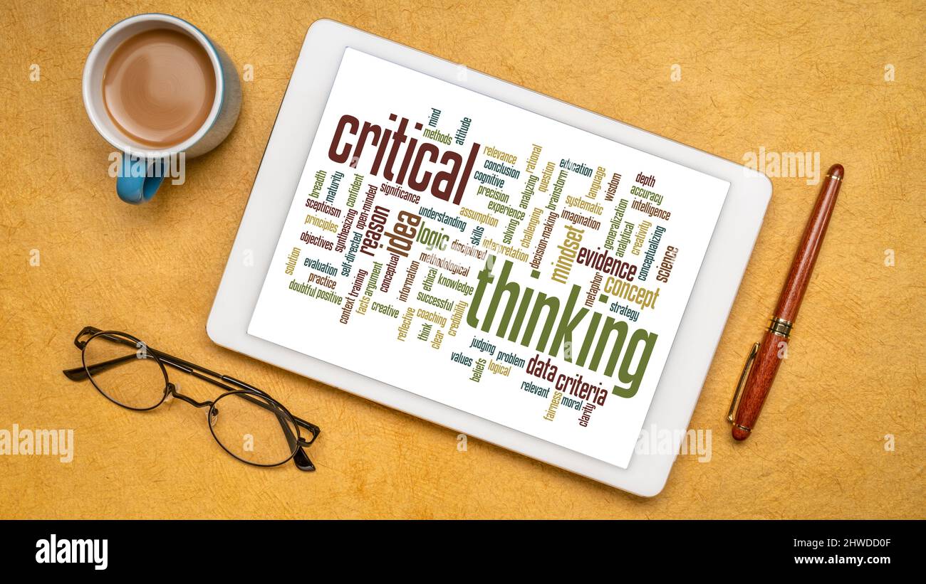 critical thinking word cloud on a digital tablet, flat lay with a cup ...