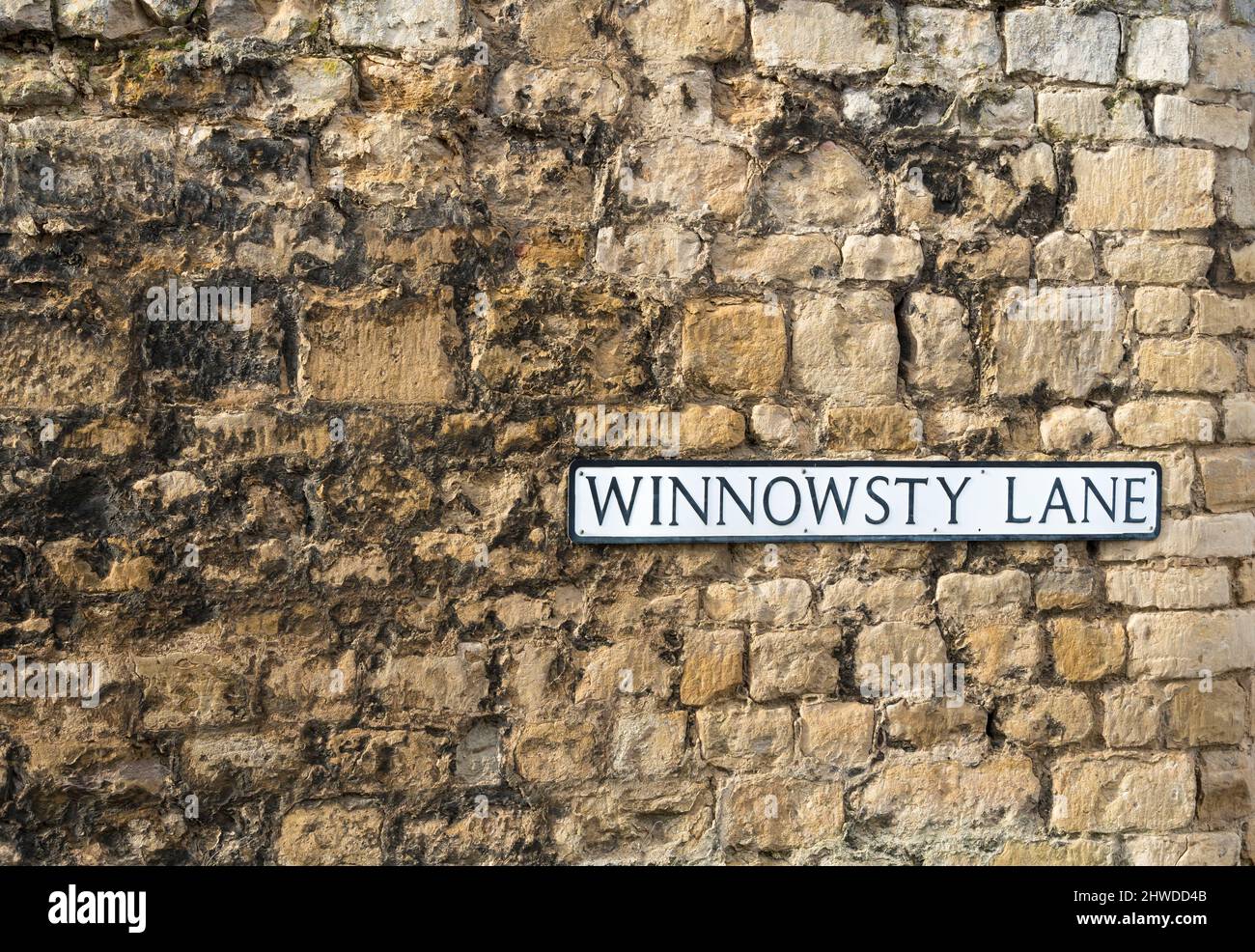 Winnowsty Lane road sign on stone wall Lincoln 2022 Stock Photo - Alamy