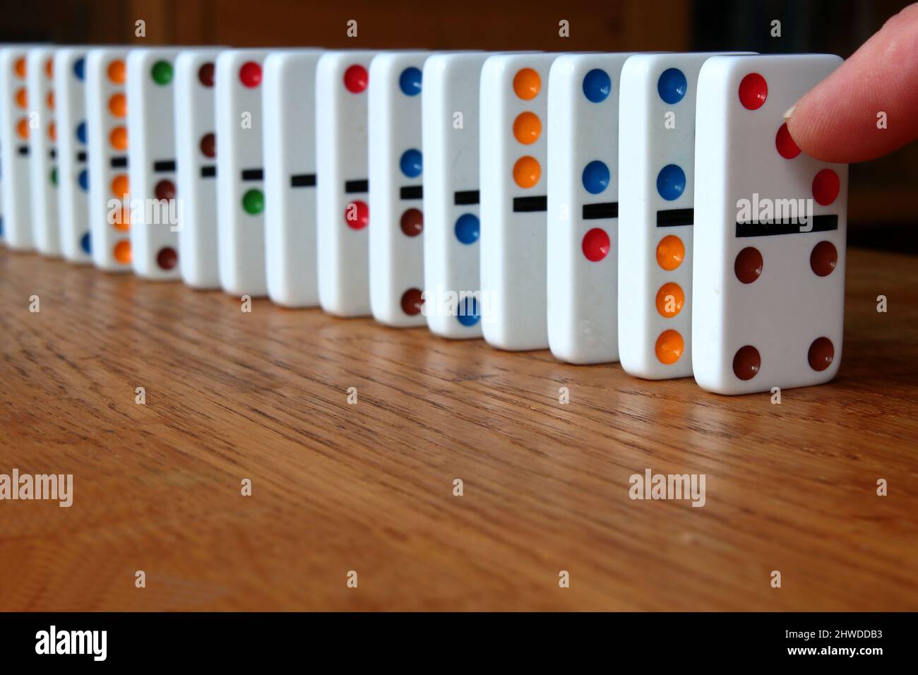 Line of dominoes ready to be pushed Stock Photo - Alamy