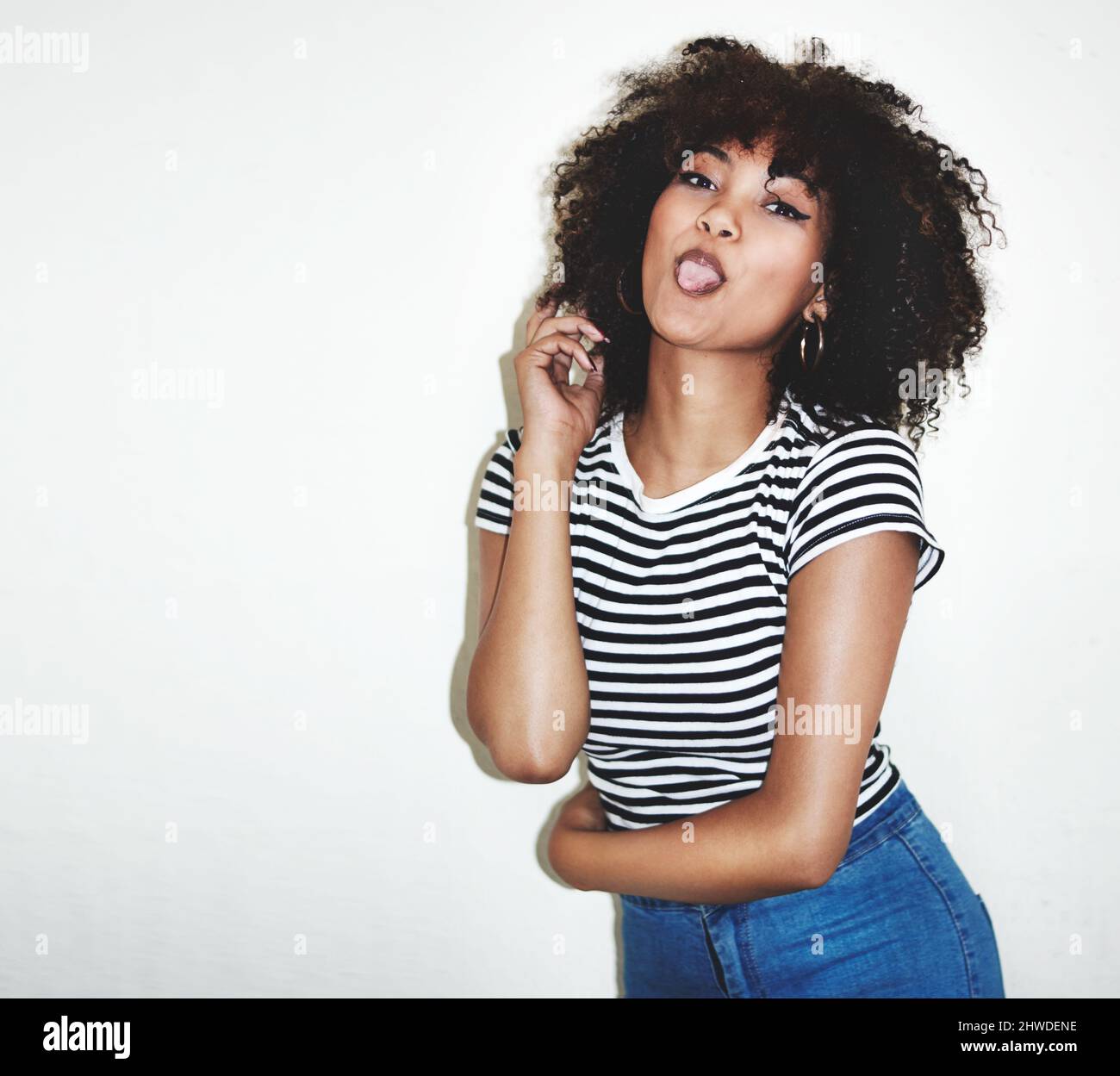 Cheeky woman sticking out tongue hi-res stock photography and images ...