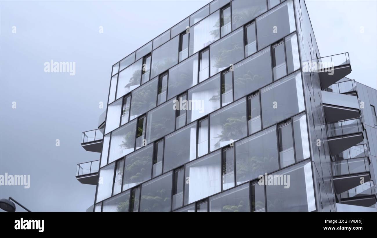 Bottom view of modern house with mirror facade. Action. Modern design ...