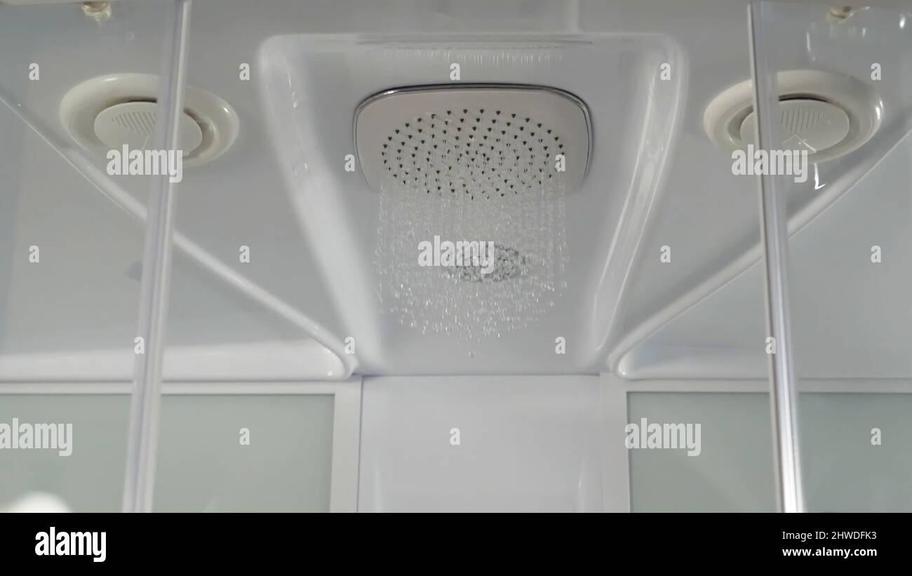 Running water of shower faucet. Shower head in bathroom with water ...