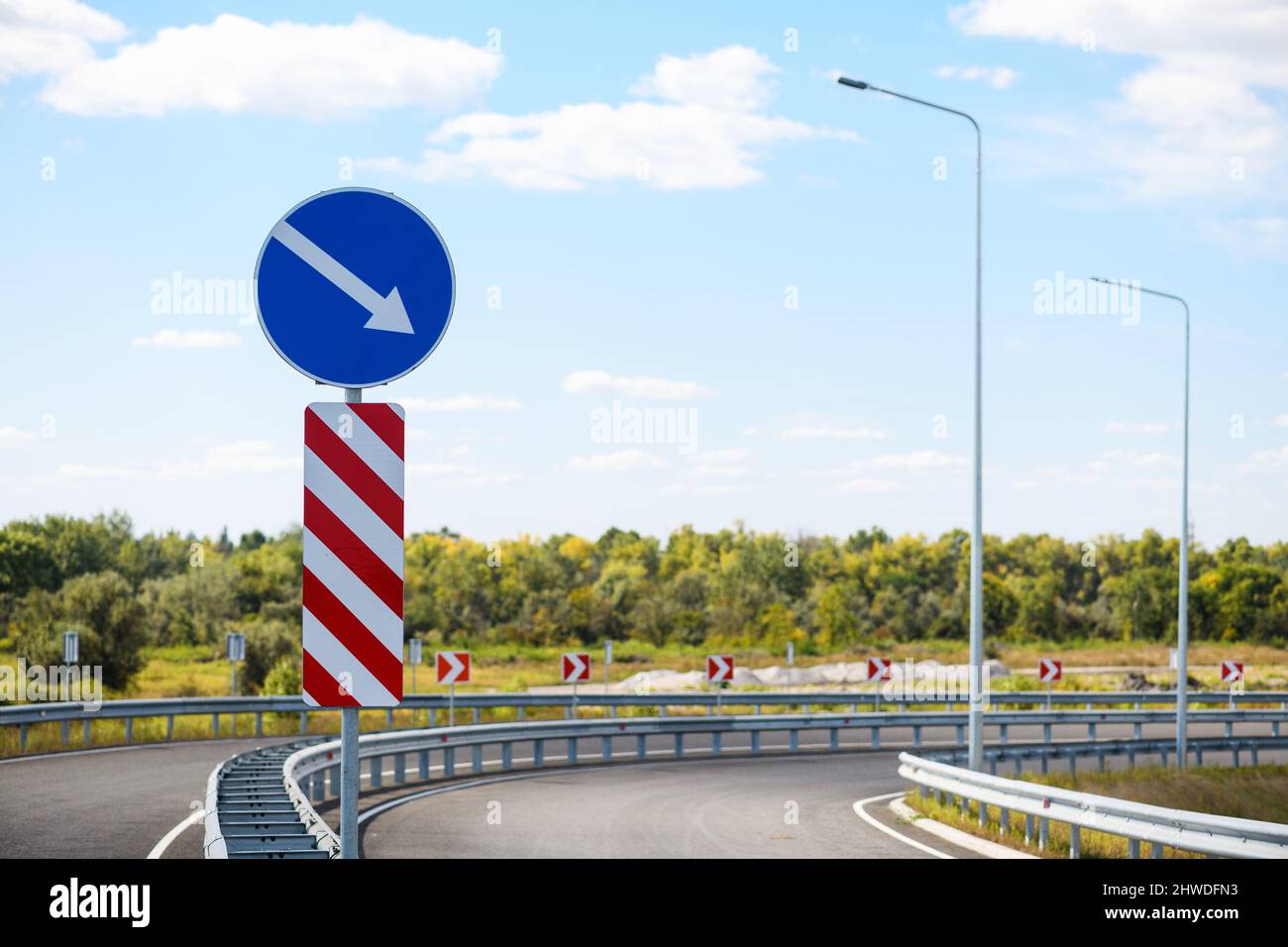 Separation barrier and direction sign detour on the right. Warning ...