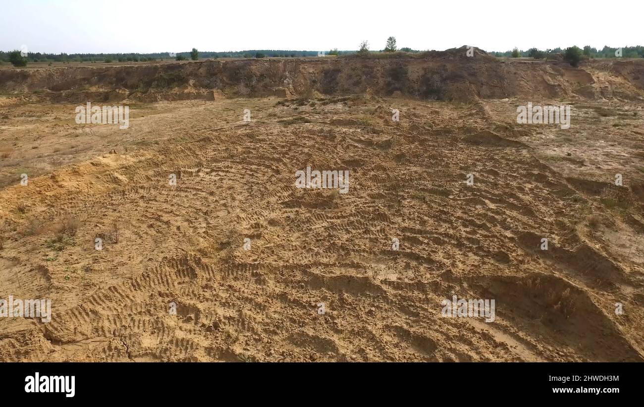 Sand quarry in countryside. Scene. Top view of empty yellow quarry with ...