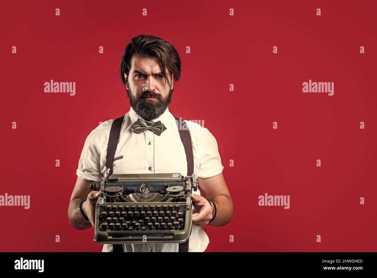 journalistic concept. brutal handsome man with moustache. mature typist ...